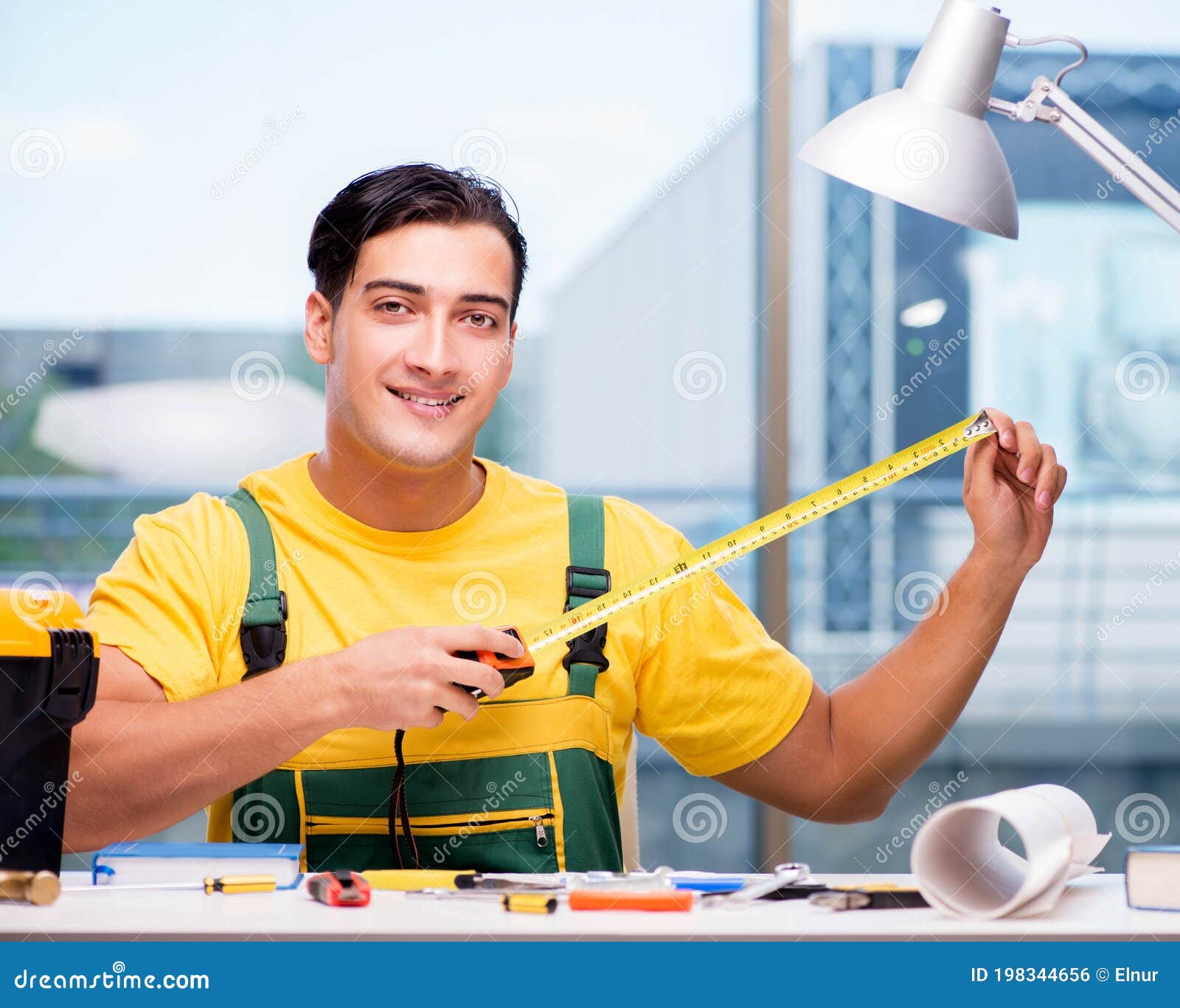 Construction Worker Sitting at the Desk Stock Photo - Image of ...