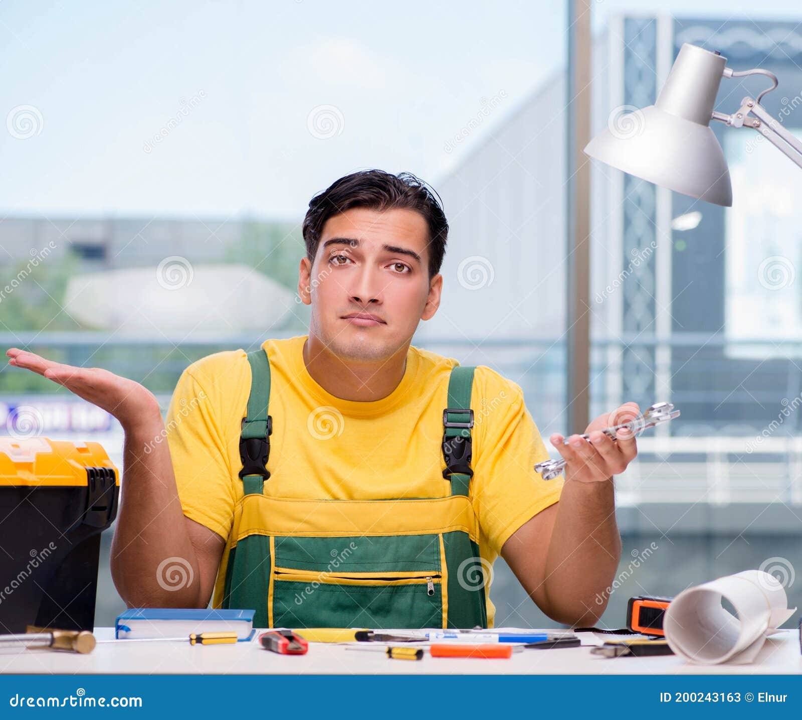 Construction Worker Sitting at the Desk Stock Image - Image of business ...