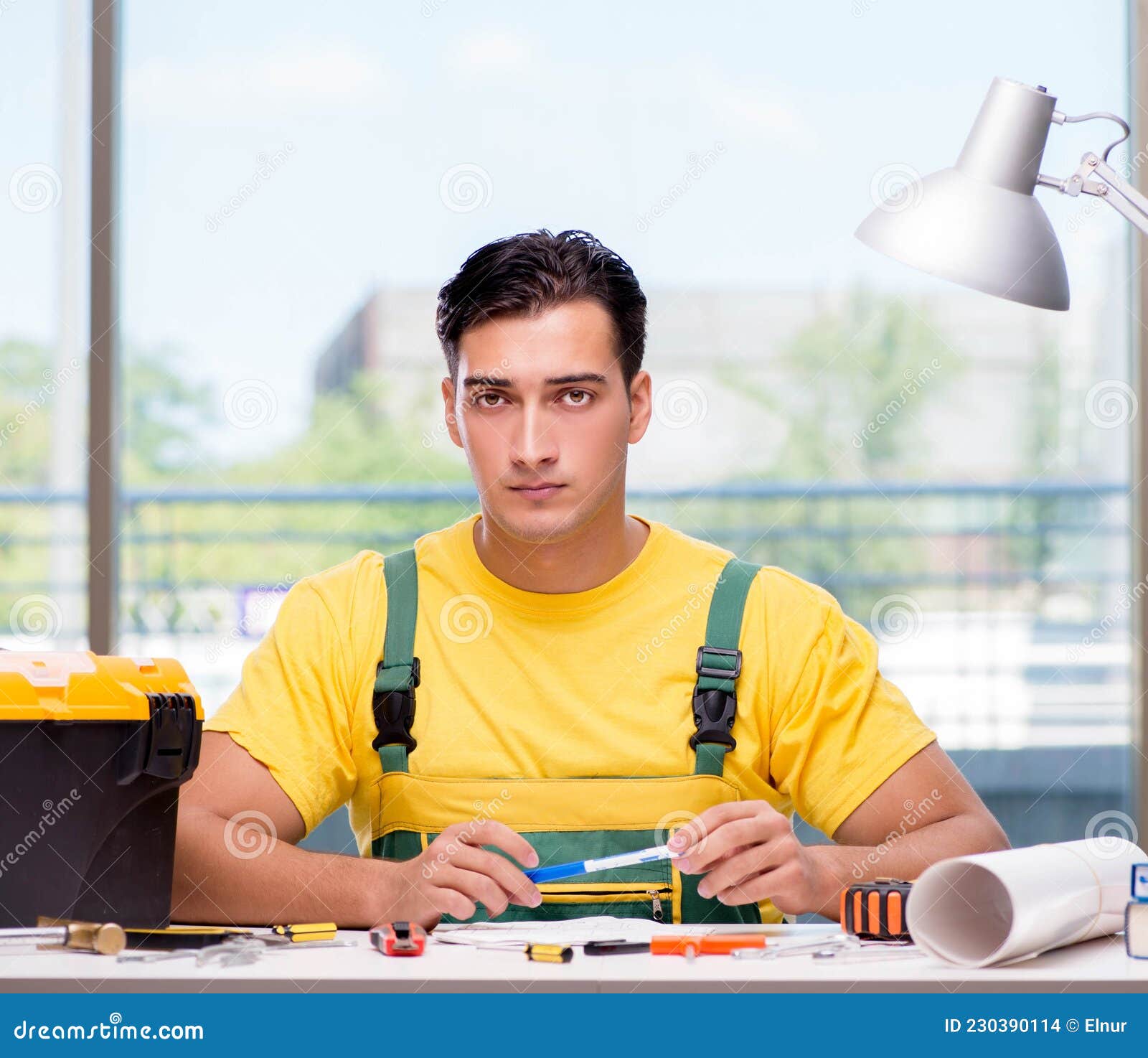 Construction Worker Sitting at the Desk Stock Photo - Image of builder ...