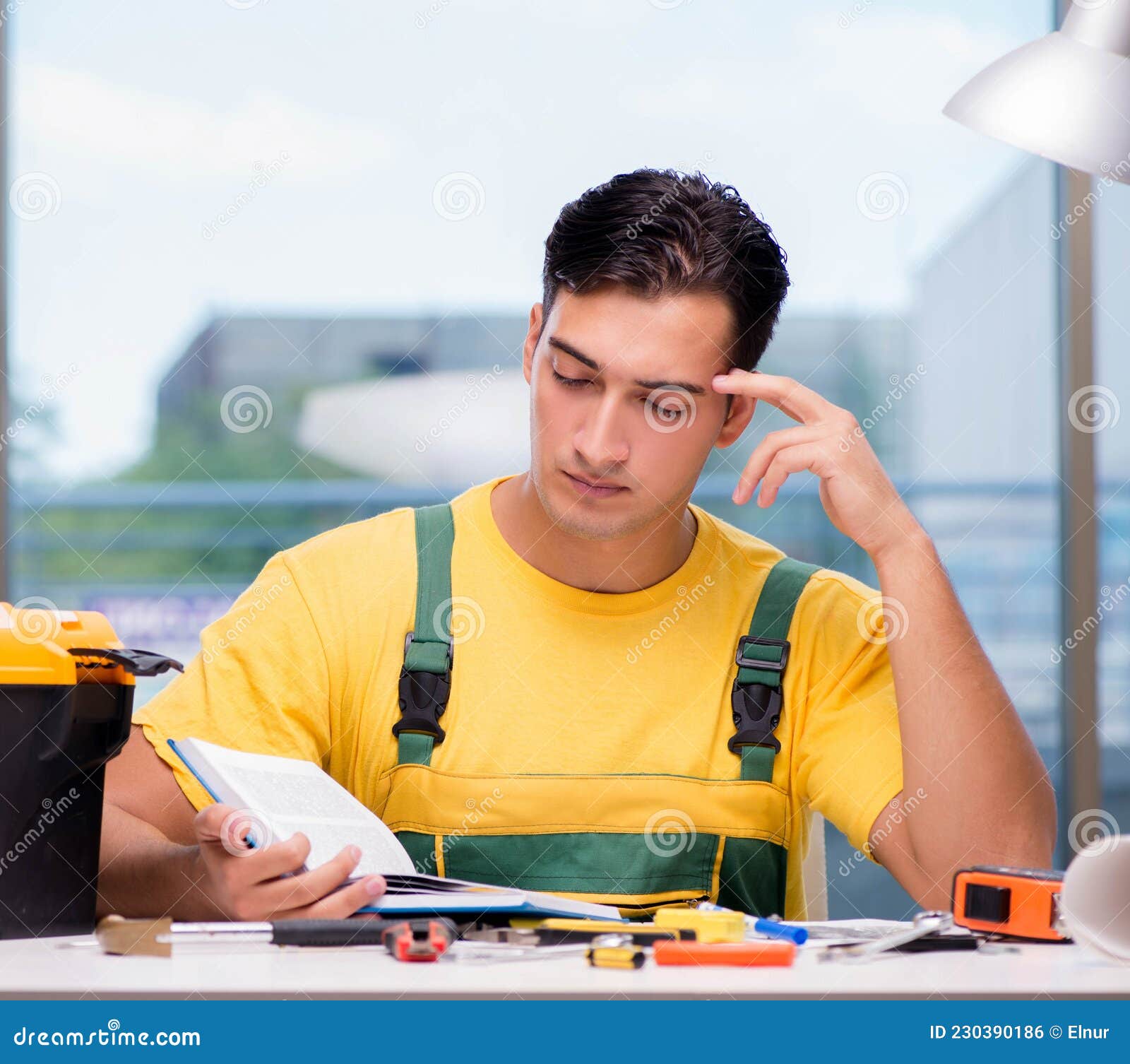 Construction Worker Sitting at the Desk Stock Photo - Image of ...