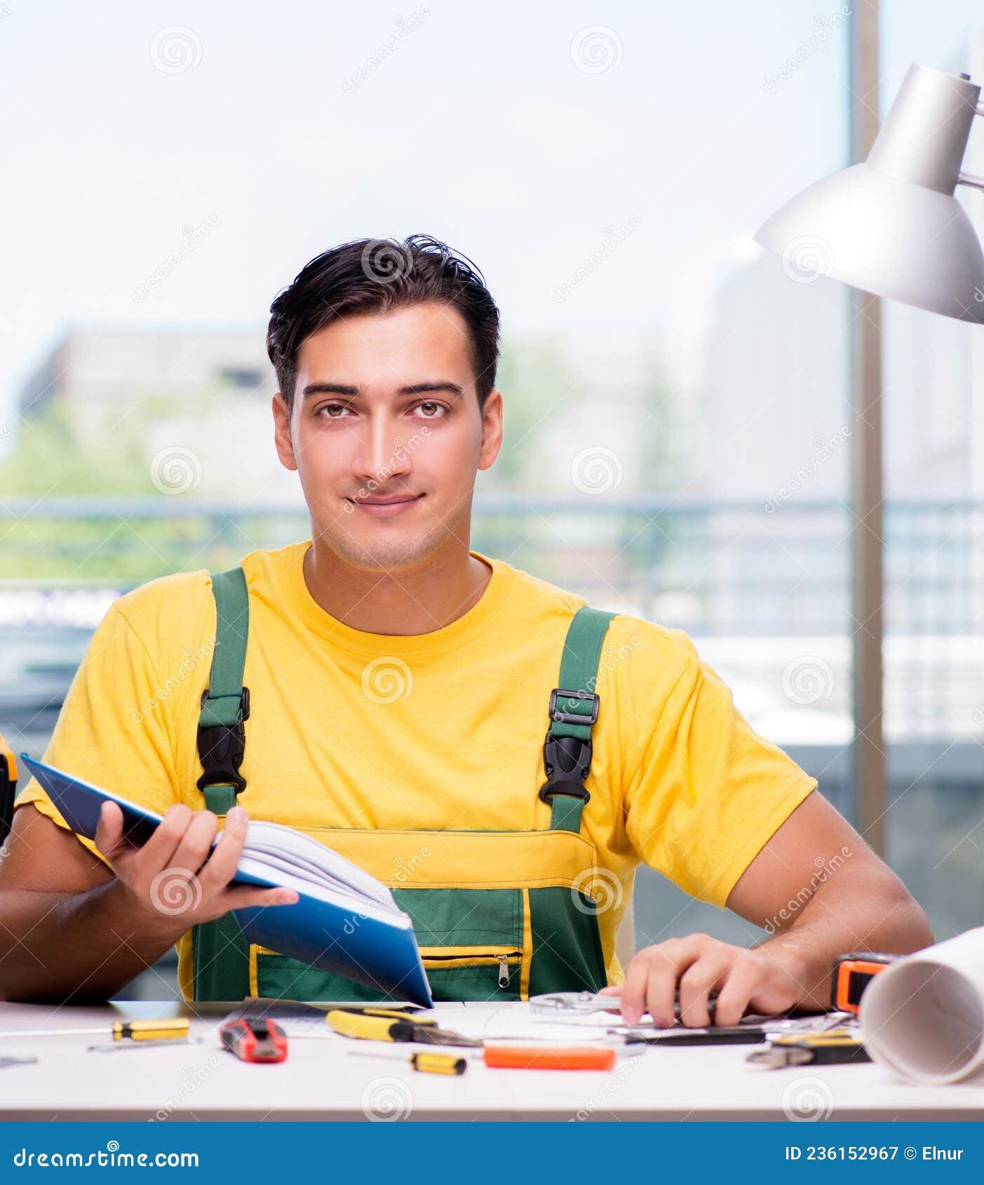 Construction Worker Sitting at the Desk Stock Image - Image of engineer ...