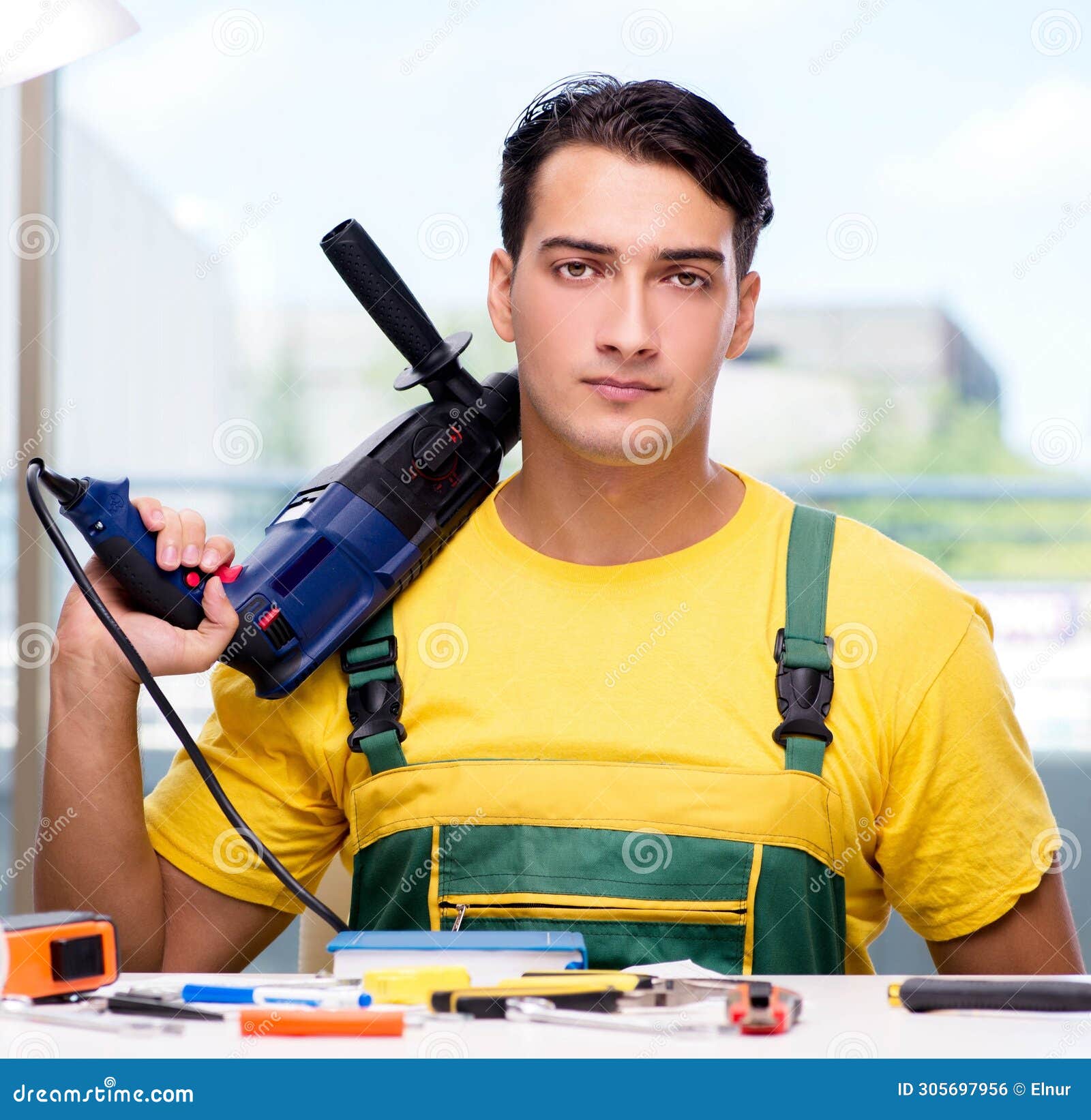 Construction Worker Sitting at the Desk Stock Photo - Image of handyman ...