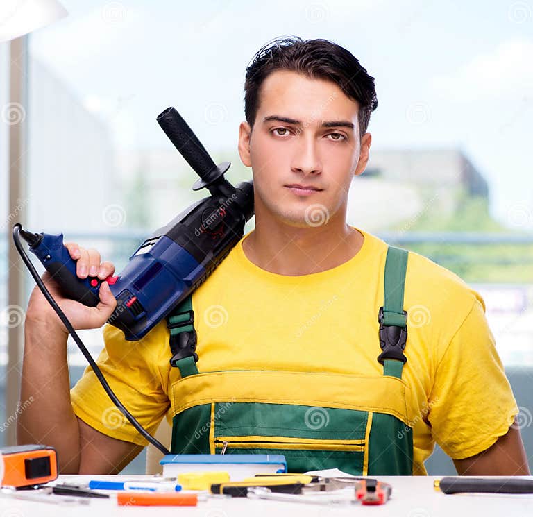 Construction Worker Sitting at the Desk Stock Photo - Image of handyman ...