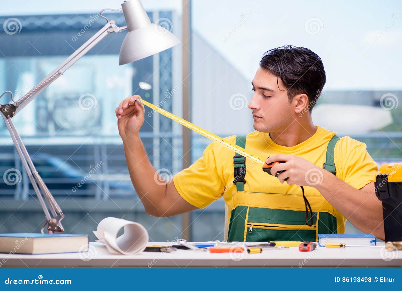 The Construction Worker Sitting at the Desk Stock Photo - Image of ...