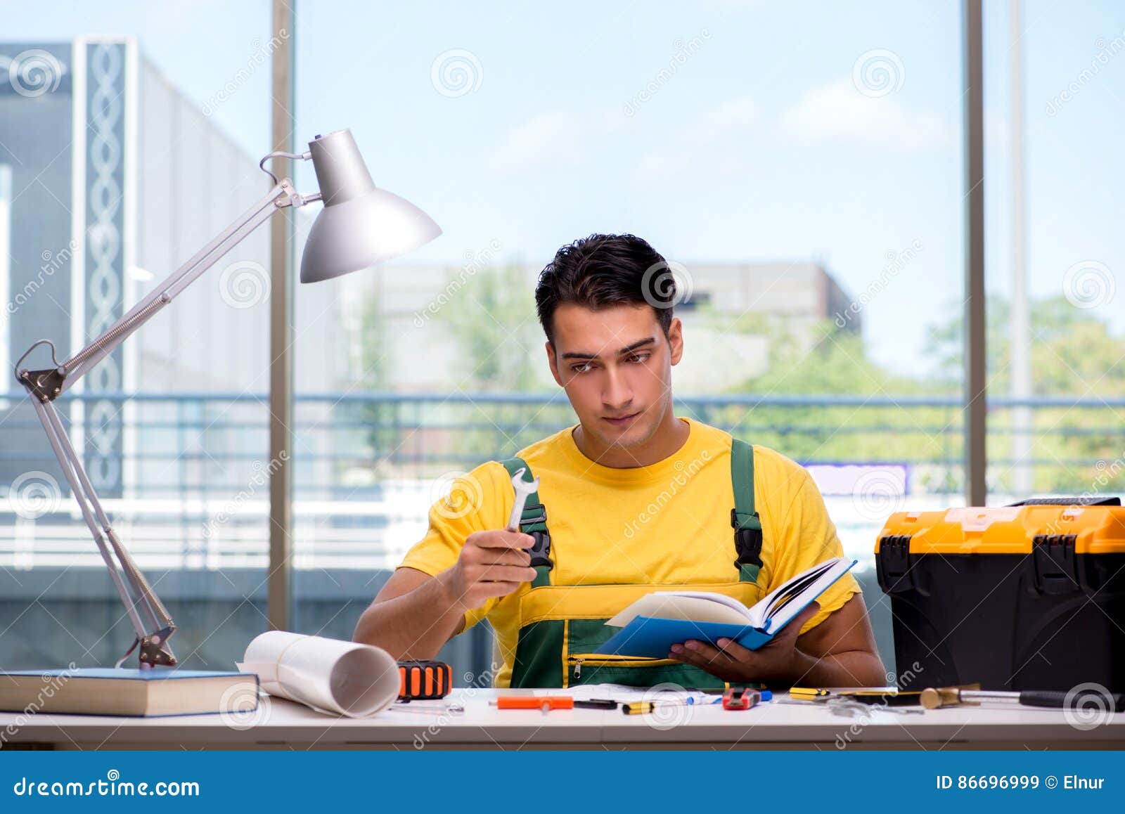 The Construction Worker Sitting at the Desk Stock Image - Image of ...