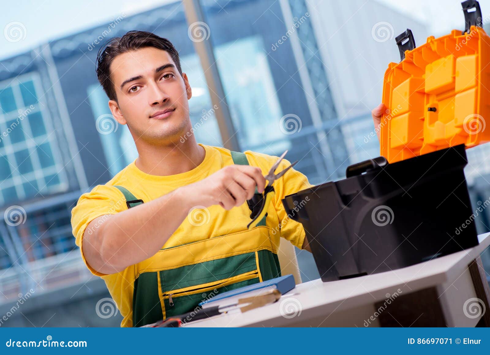 The Construction Worker Sitting at the Desk Stock Image - Image of ...