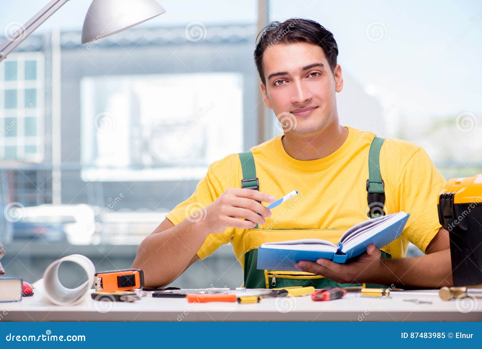 The Construction Worker Sitting at the Desk Stock Image - Image of ...