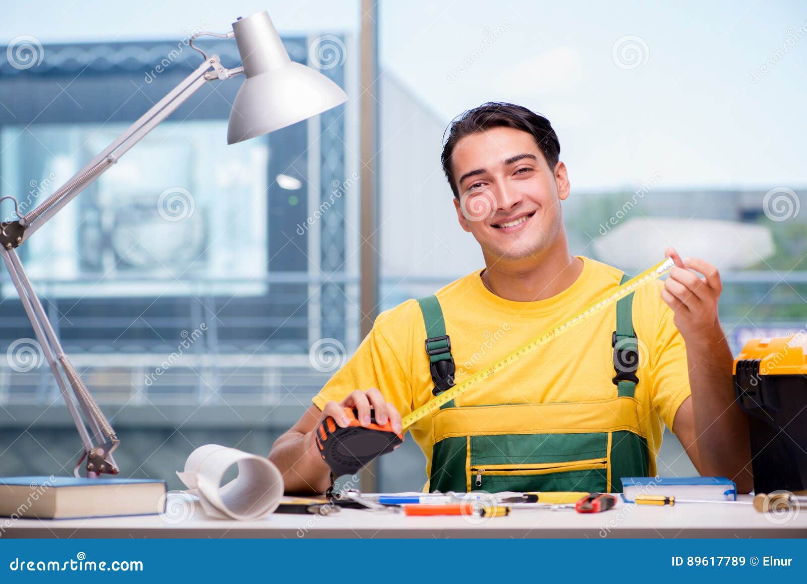 The Construction Worker Sitting at the Desk Stock Image - Image of ...