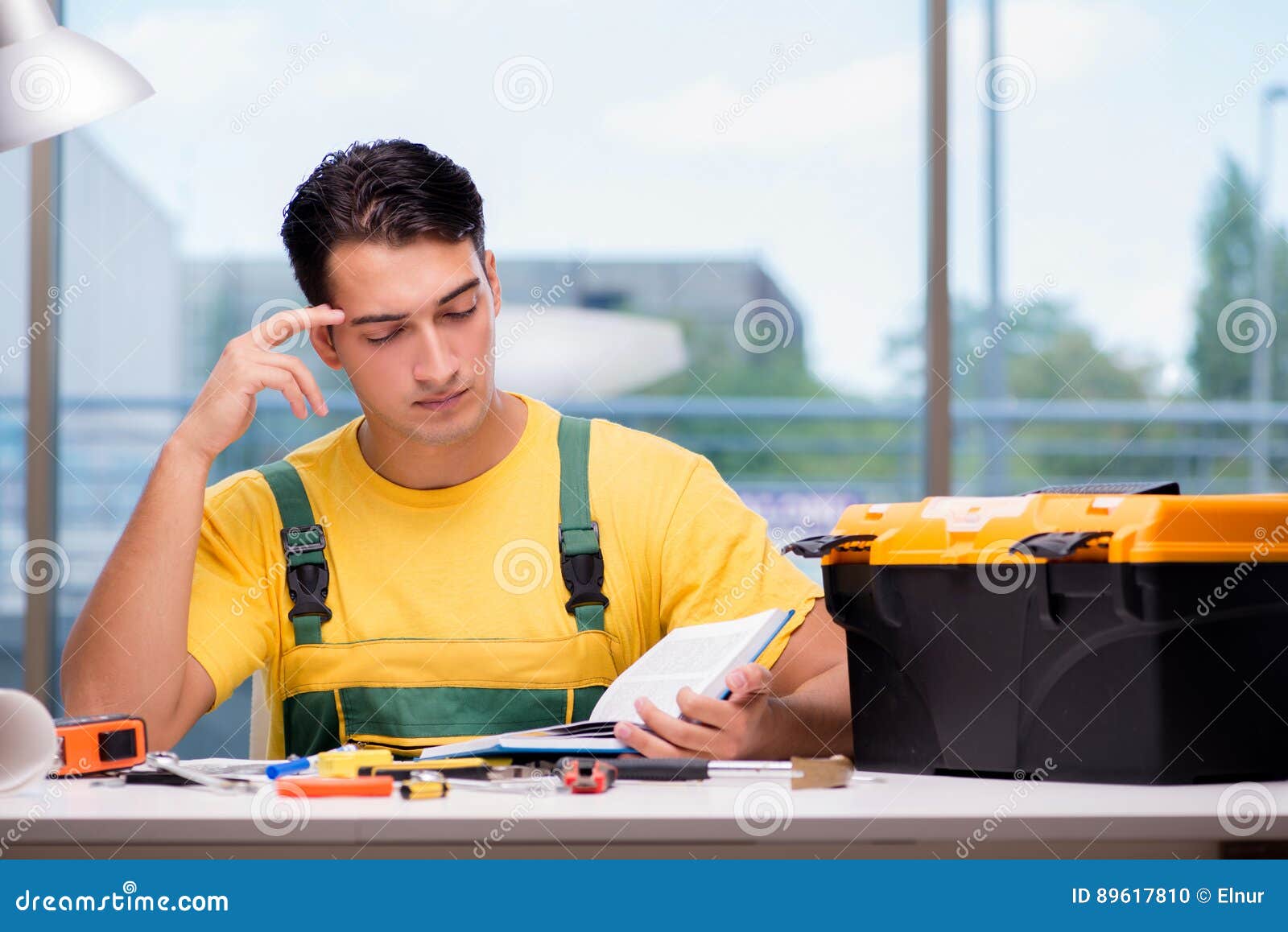 The Construction Worker Sitting at the Desk Stock Photo - Image of ...