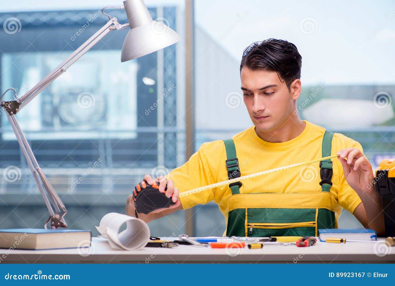 The Construction Worker Sitting at the Desk Stock Image - Image of home ...