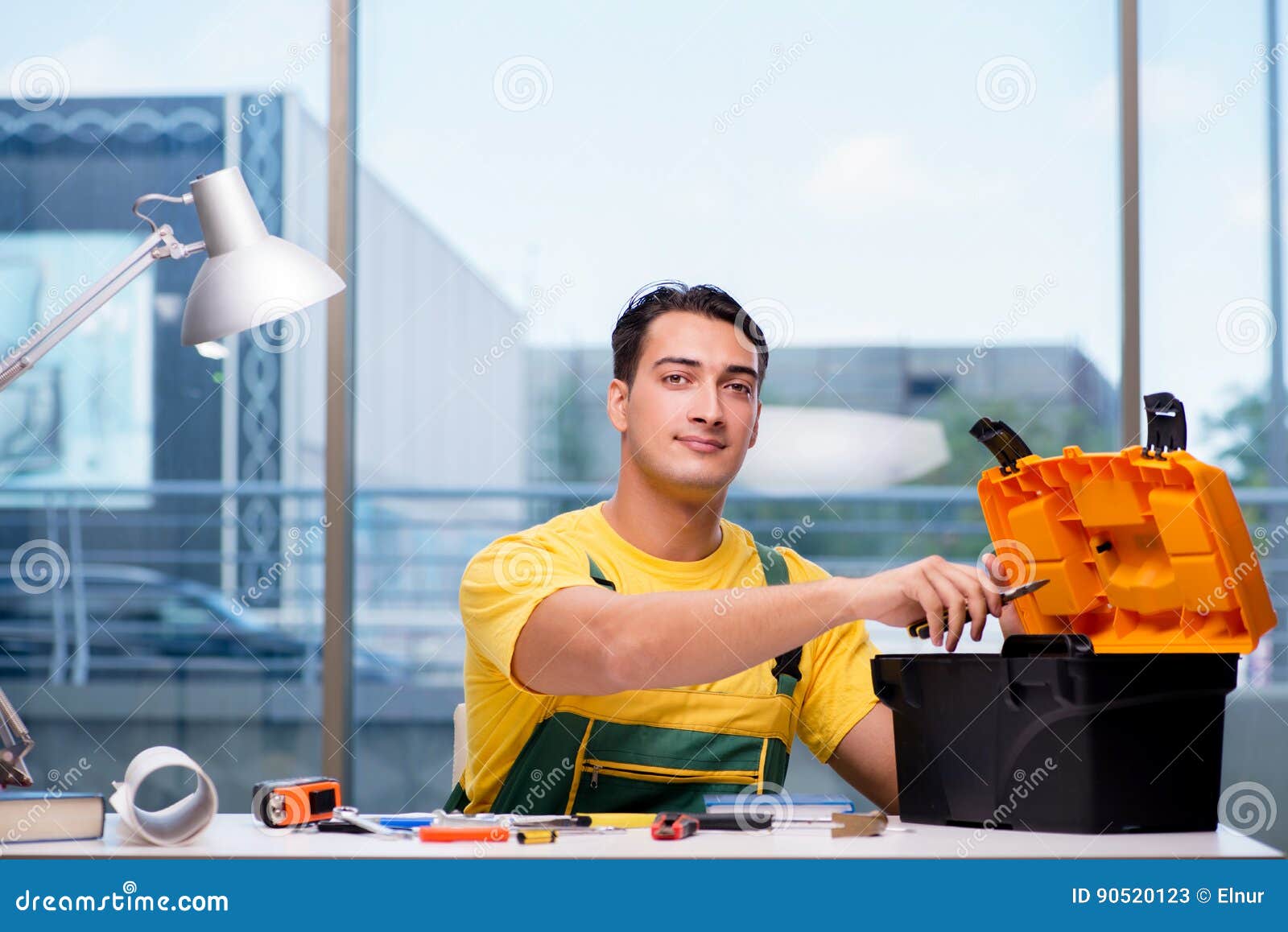The Construction Worker Sitting at the Desk Stock Image - Image of ...