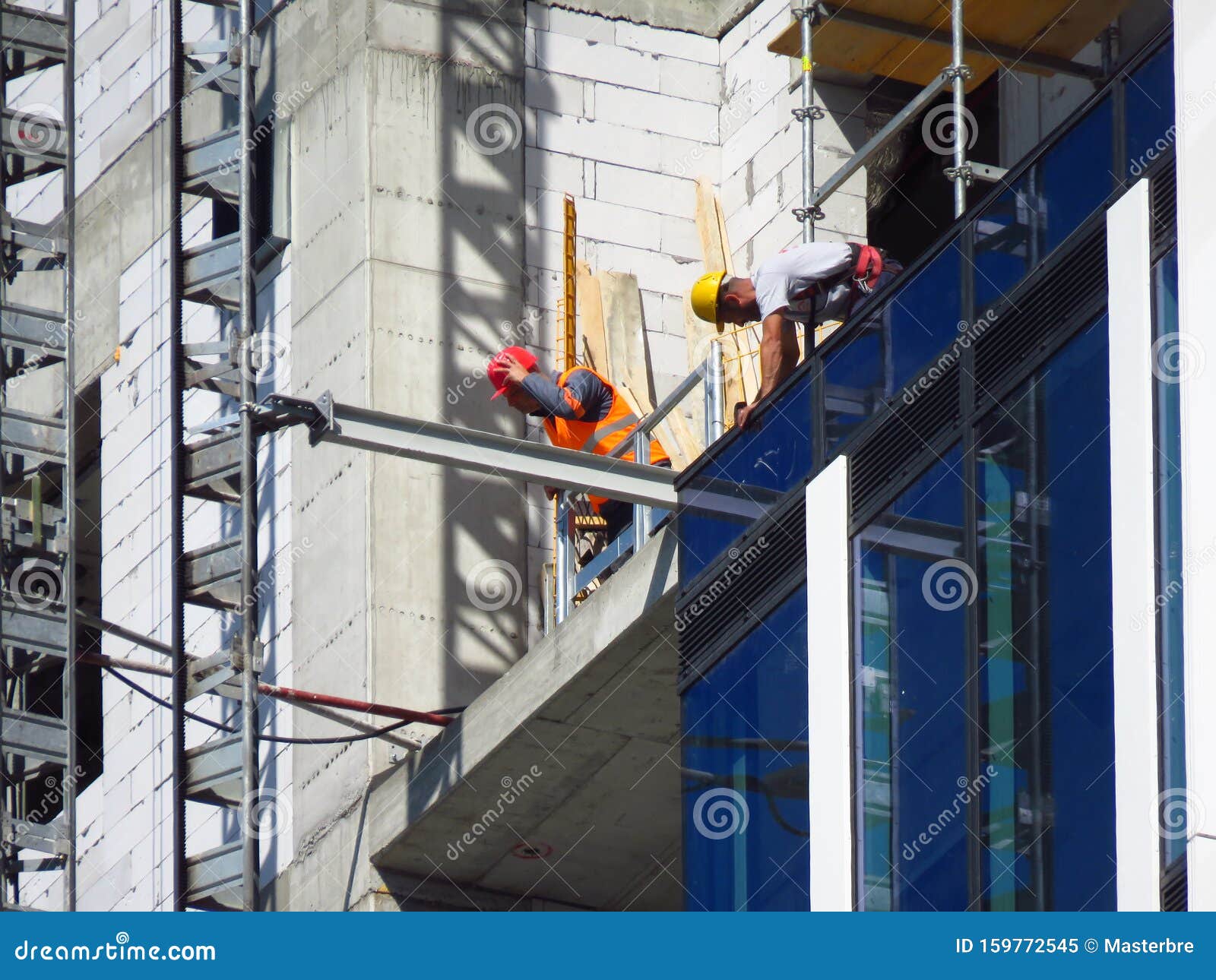 Construction Worker at Skyscraper Construction Site. Finishing of the ...