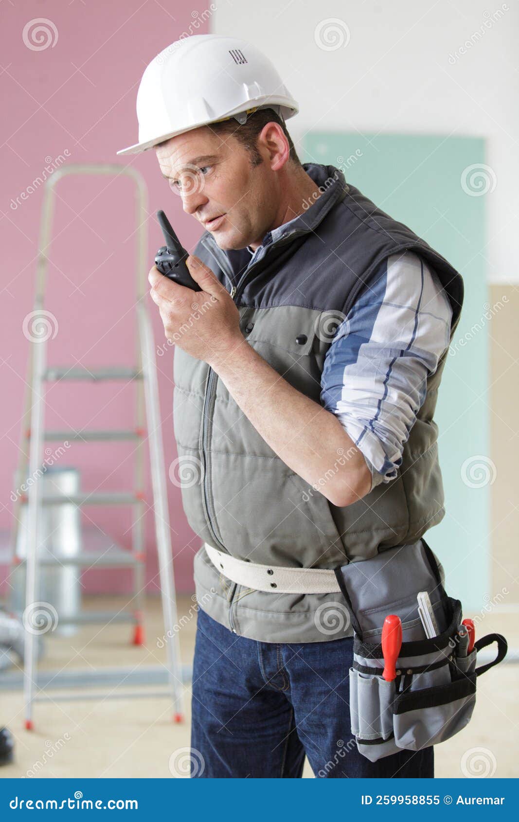 Construction Worker Speaking by Walkie-talkie Stock Image - Image of ...