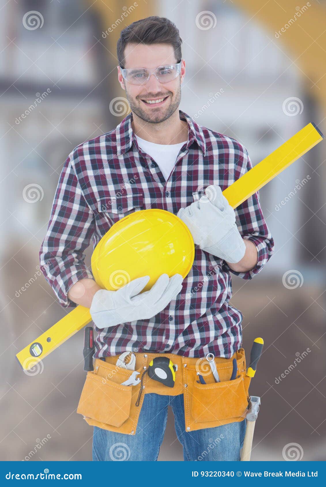 Construction Worker with Spirit Level in Front of Construction Site ...
