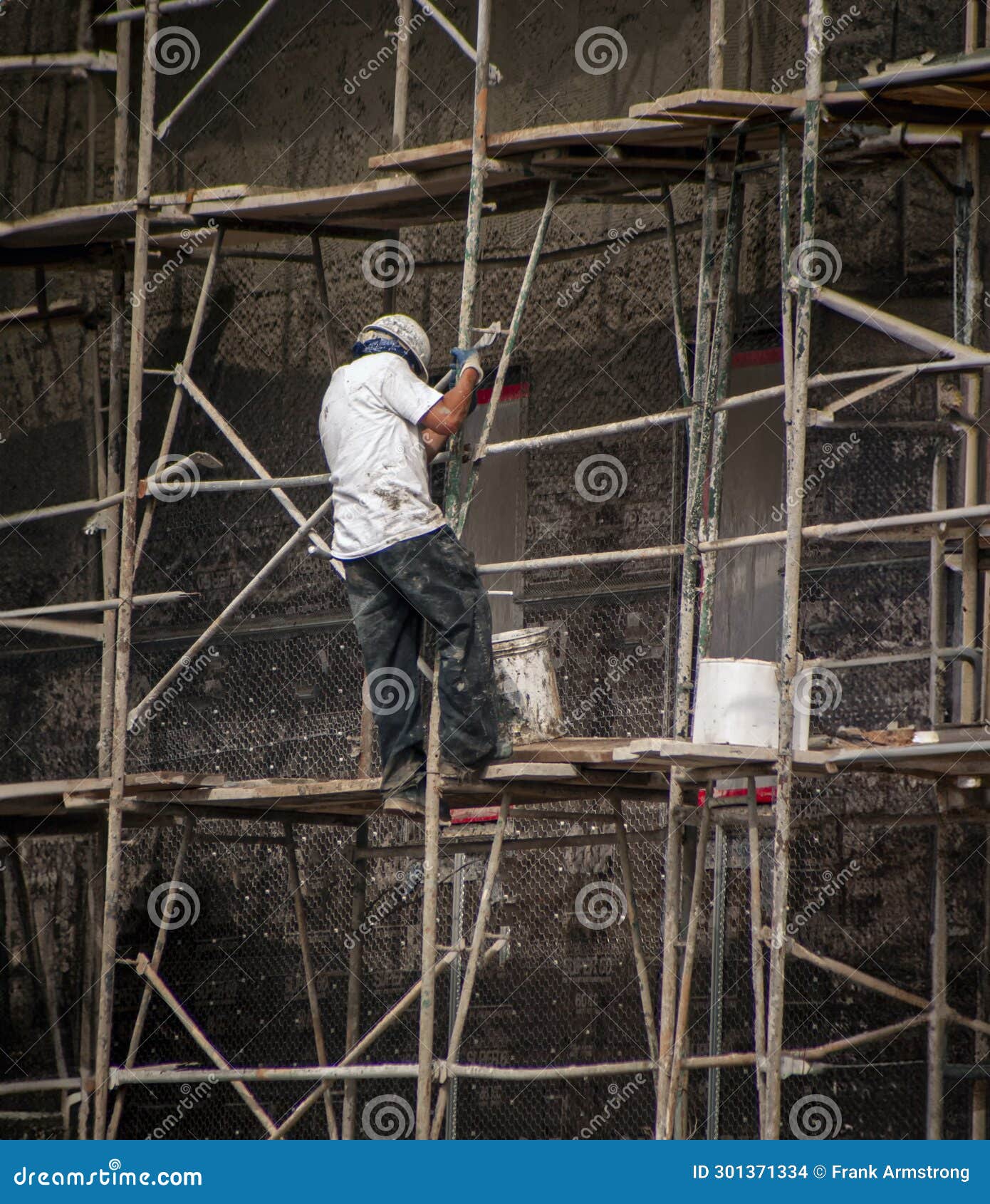 Construction Workers Spraying Stucco on the Exterior of a Building ...