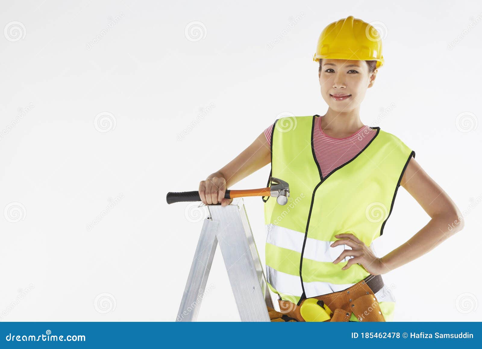 Construction Worker Standing on Ladder, Holding a Hammer Stock Photo ...