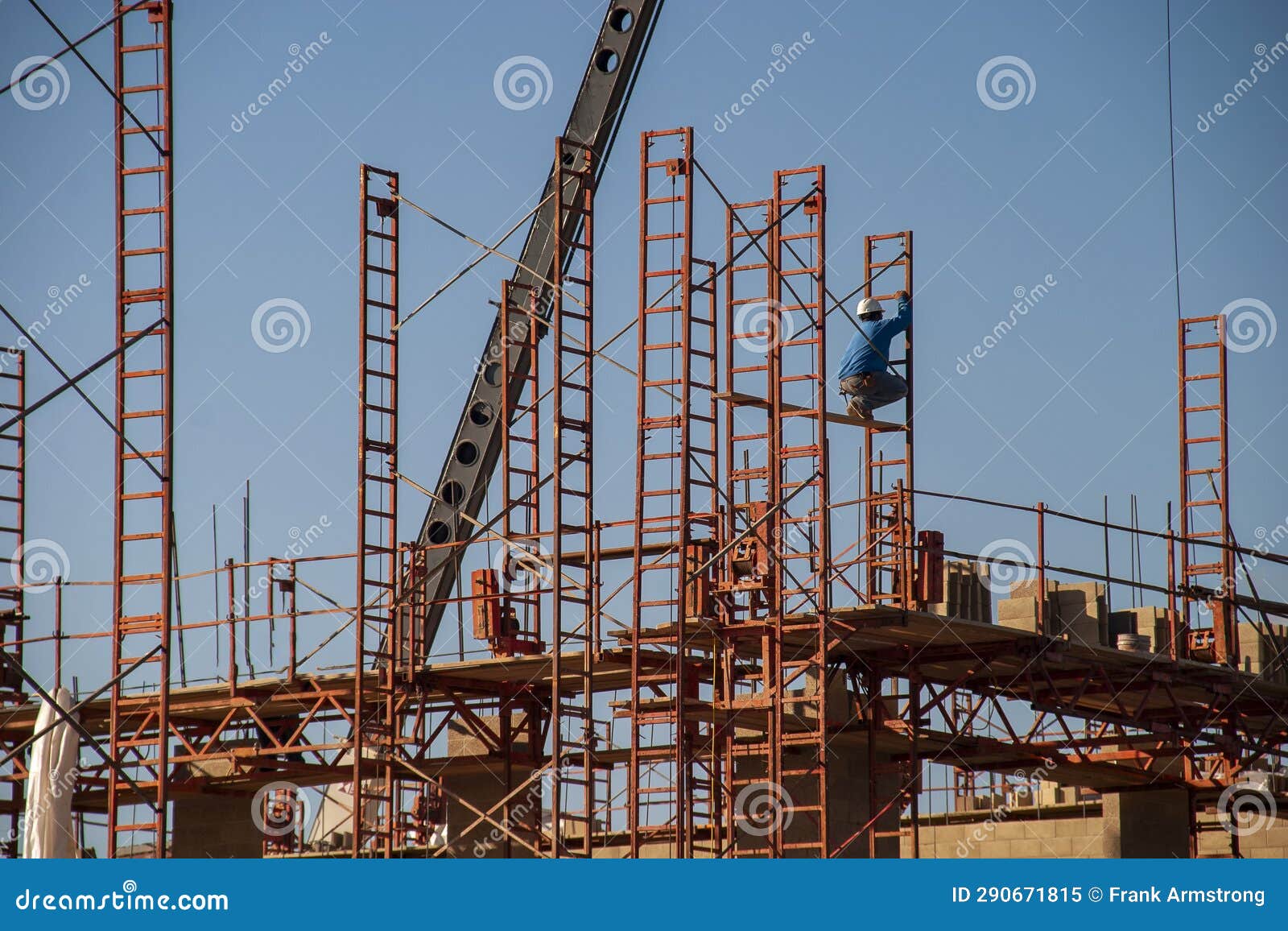 Worker Standing In Front Of Main Control Board In A Control Operations ...