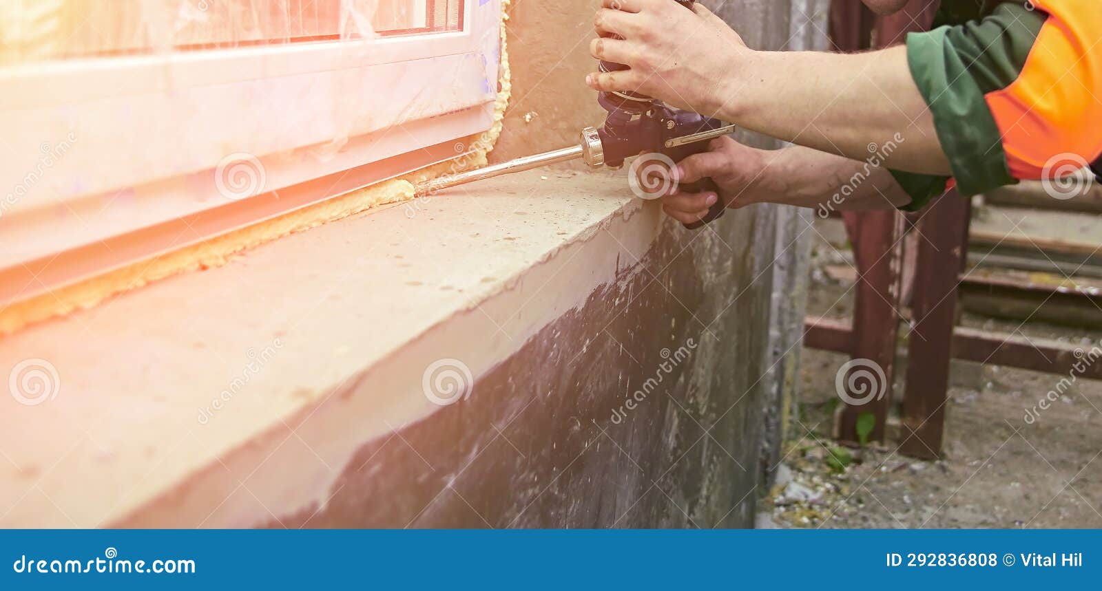 A Construction Worker Sticks Sealing Foam Tape on a Window in a House ...