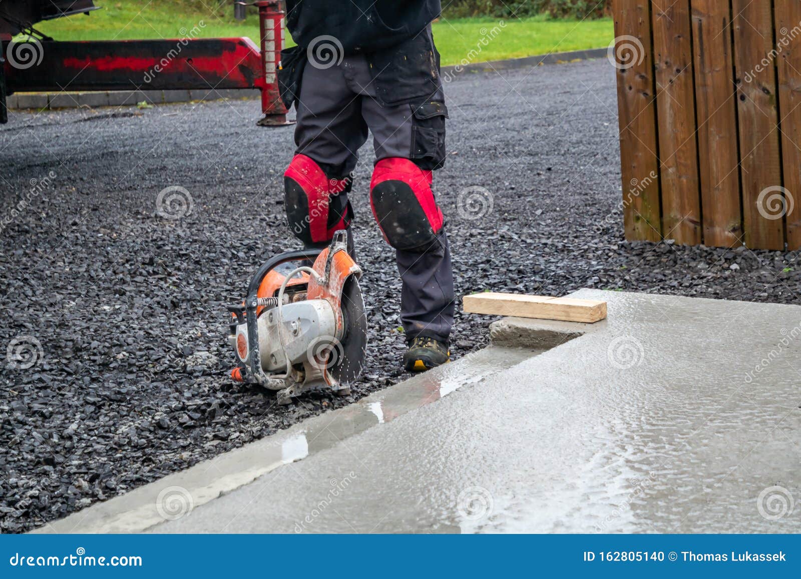 Construction Worker at Stone Cutting Work at Concrete Base by Cut-off ...