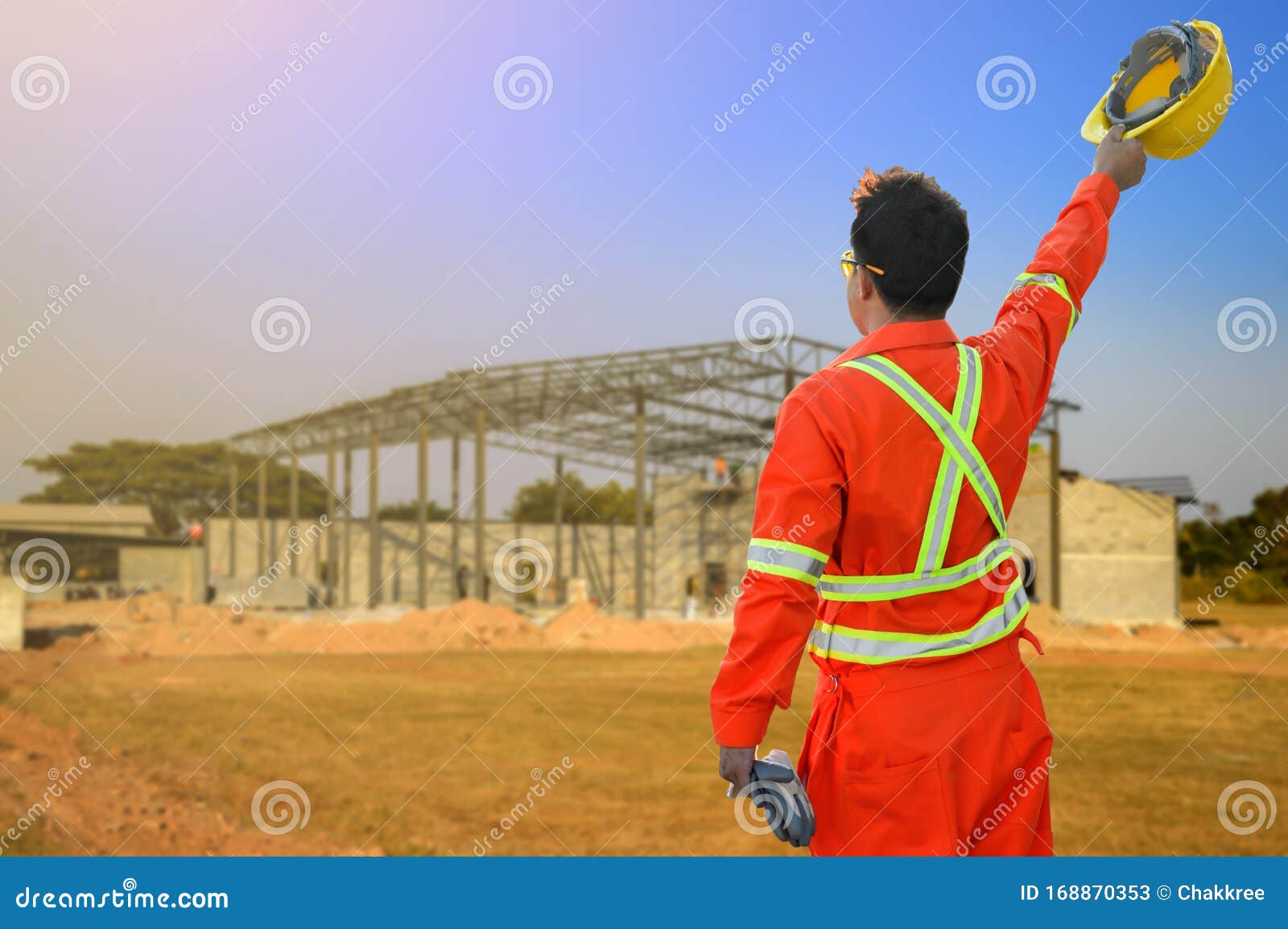 A Construction Worker Supervising the Construction of Building Frames ...