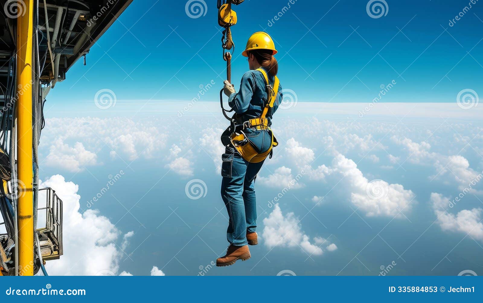 A Construction Worker is Suspended High Above the Clouds, Secured by a ...