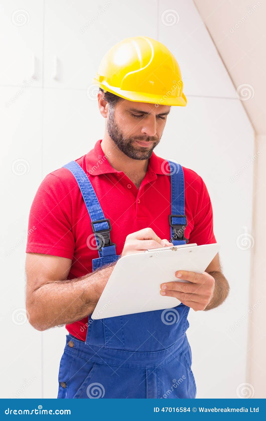 Construction Worker Taking Notes on Clipboard Stock Photo - Image of ...