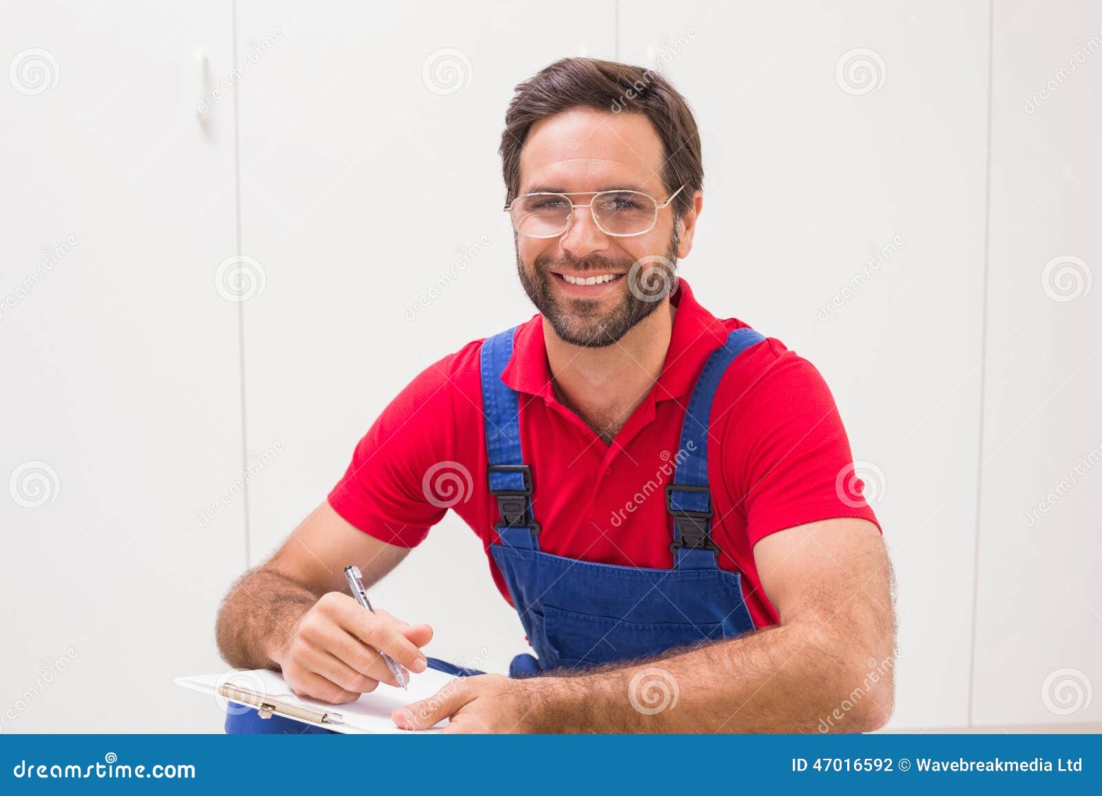 Construction Worker Taking Notes on Clipboard Stock Photo - Image of ...