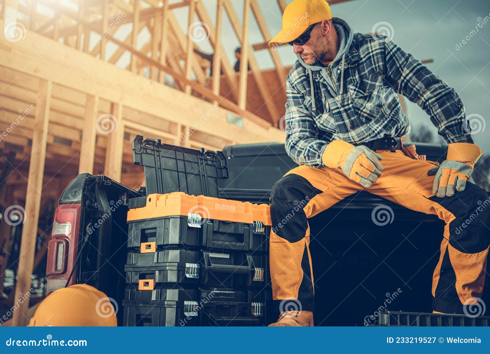 Construction Worker Taking Short Break while Working on House Framing ...
