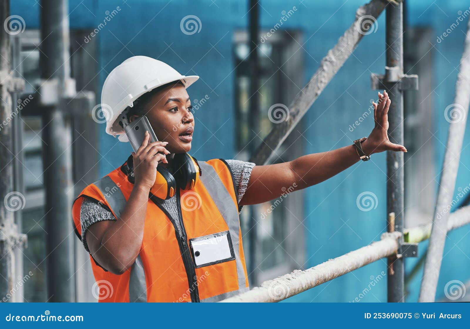 Construction Worker Talking on a Phone Call while Standing in an Empty ...
