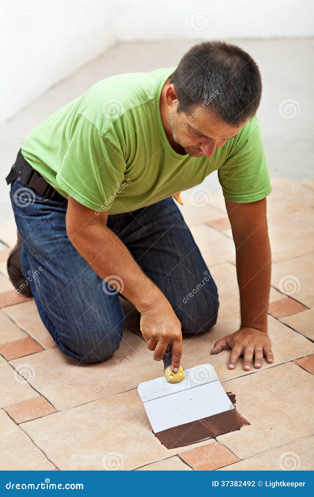 Construction Worker Testing the Joint Color on Ceramic Tiles Flo Stock ...