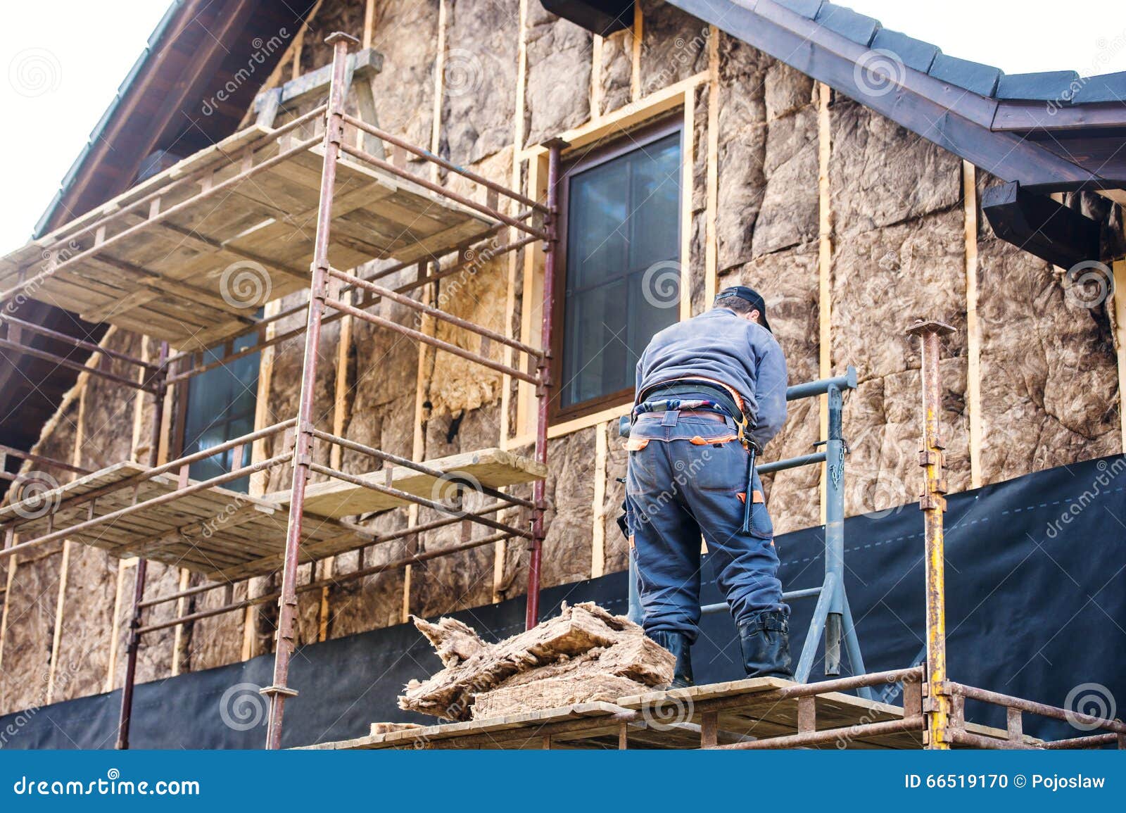 Construction Worker Thermally Insulating House Facade with Glass Wool ...