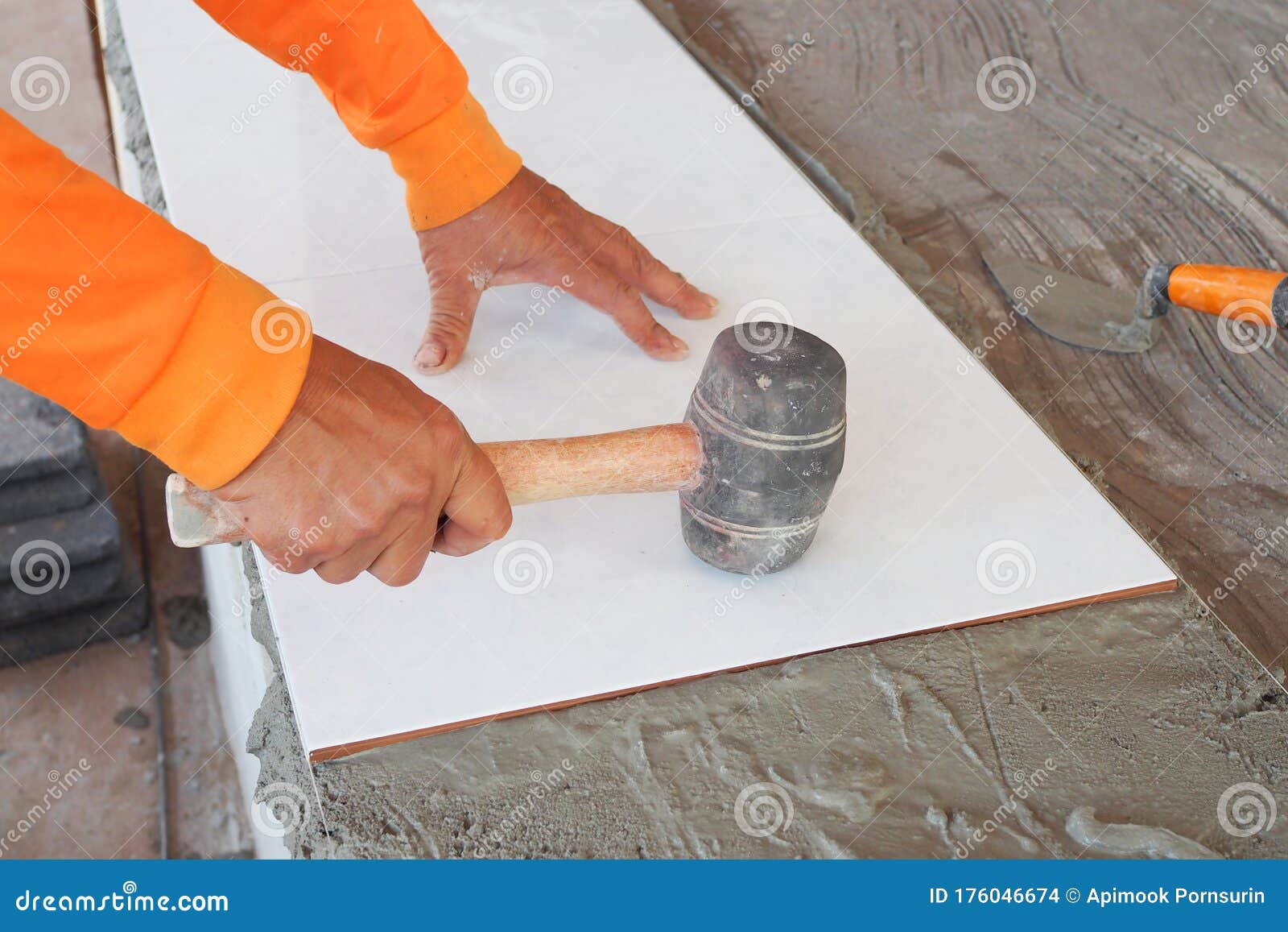 Construction Worker Tiler is Tiling, Tiler Installing Ceramic Tiles ...