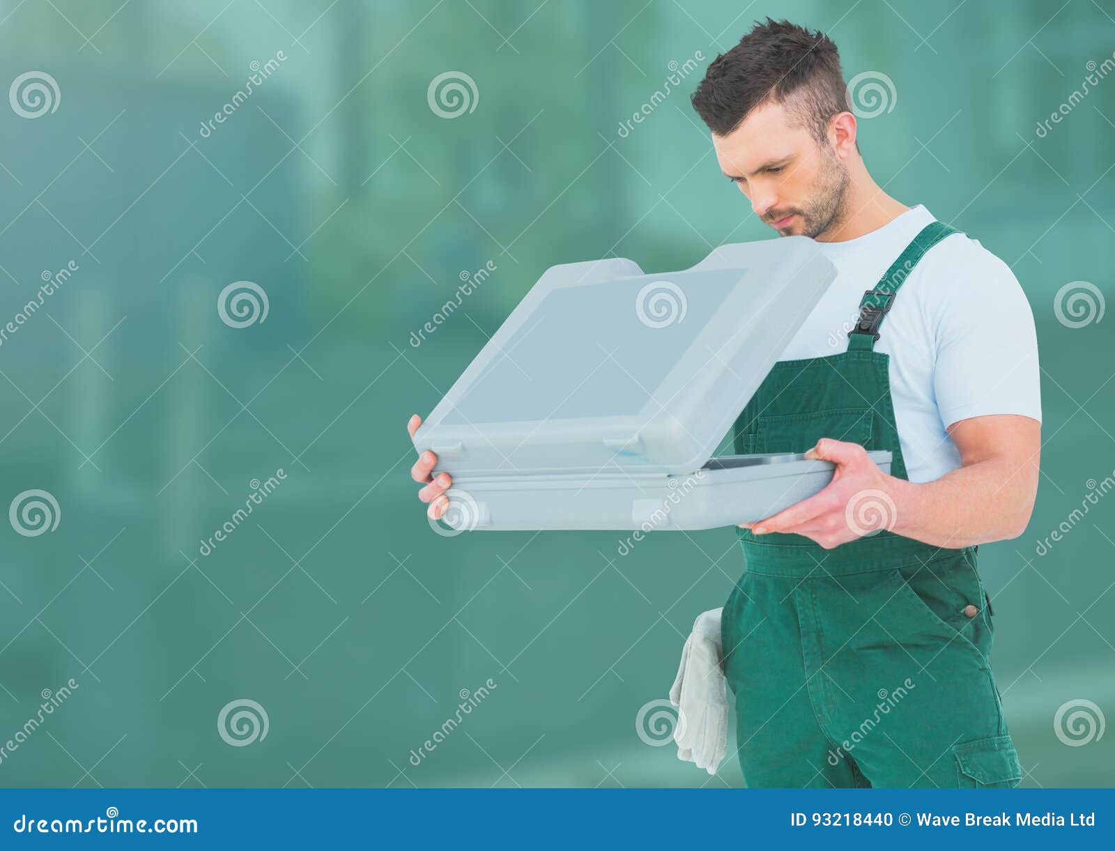 Construction Worker with Tool Box in Front of Construction Site Stock ...