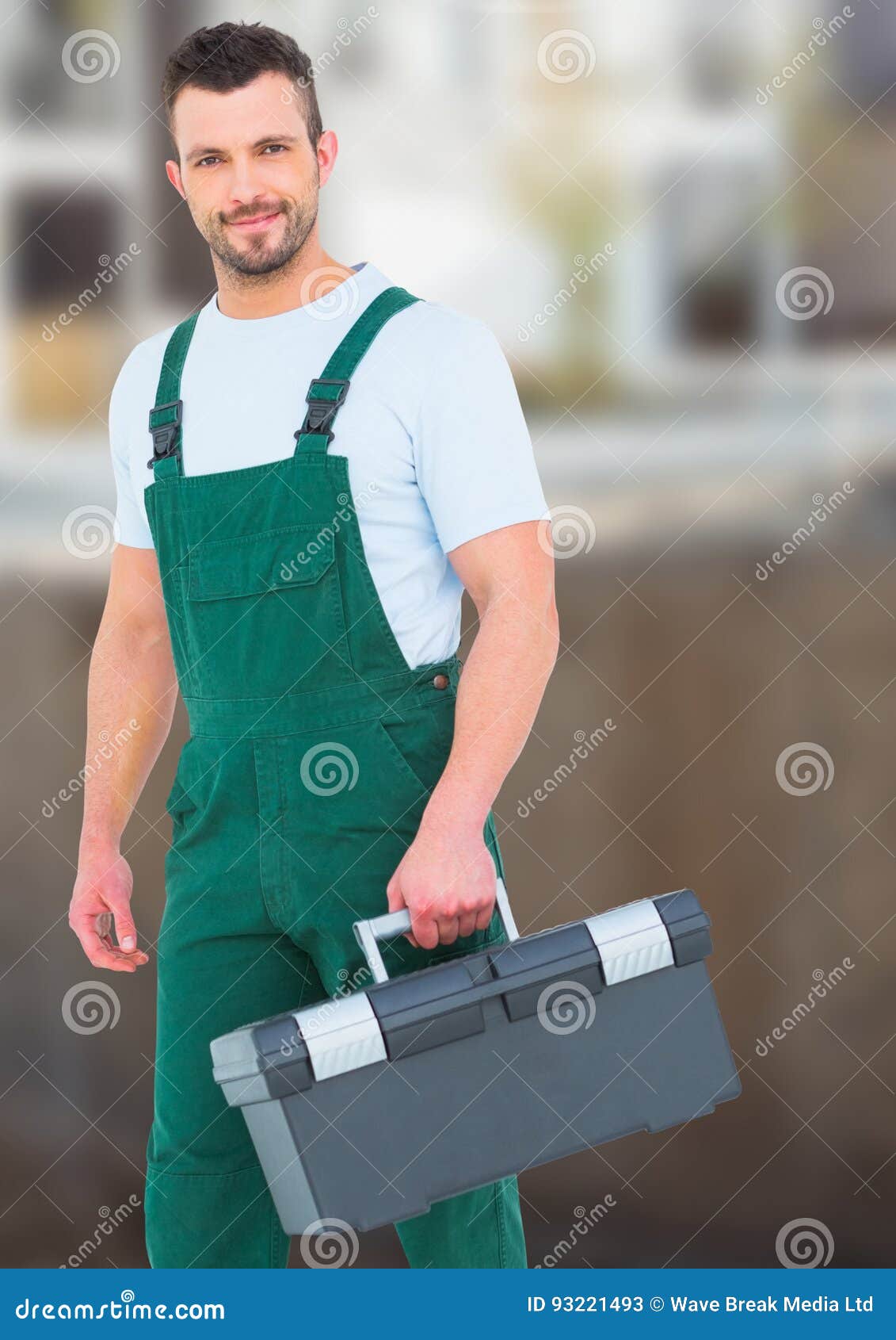 Construction Worker with Tool Box in Front of Construction Site Stock ...