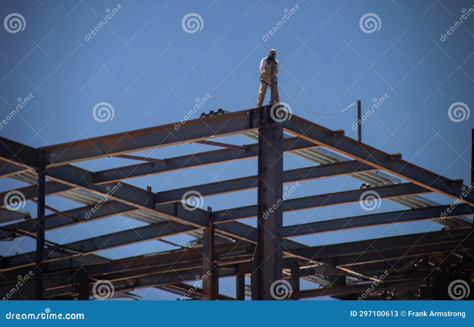 A Construction Worker on the the Top of an Iron Beam Framing of a ...