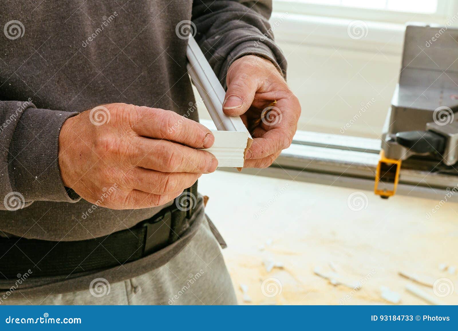 Construction Worker, Trimming Parquet on Using Circular Miter Saw ...