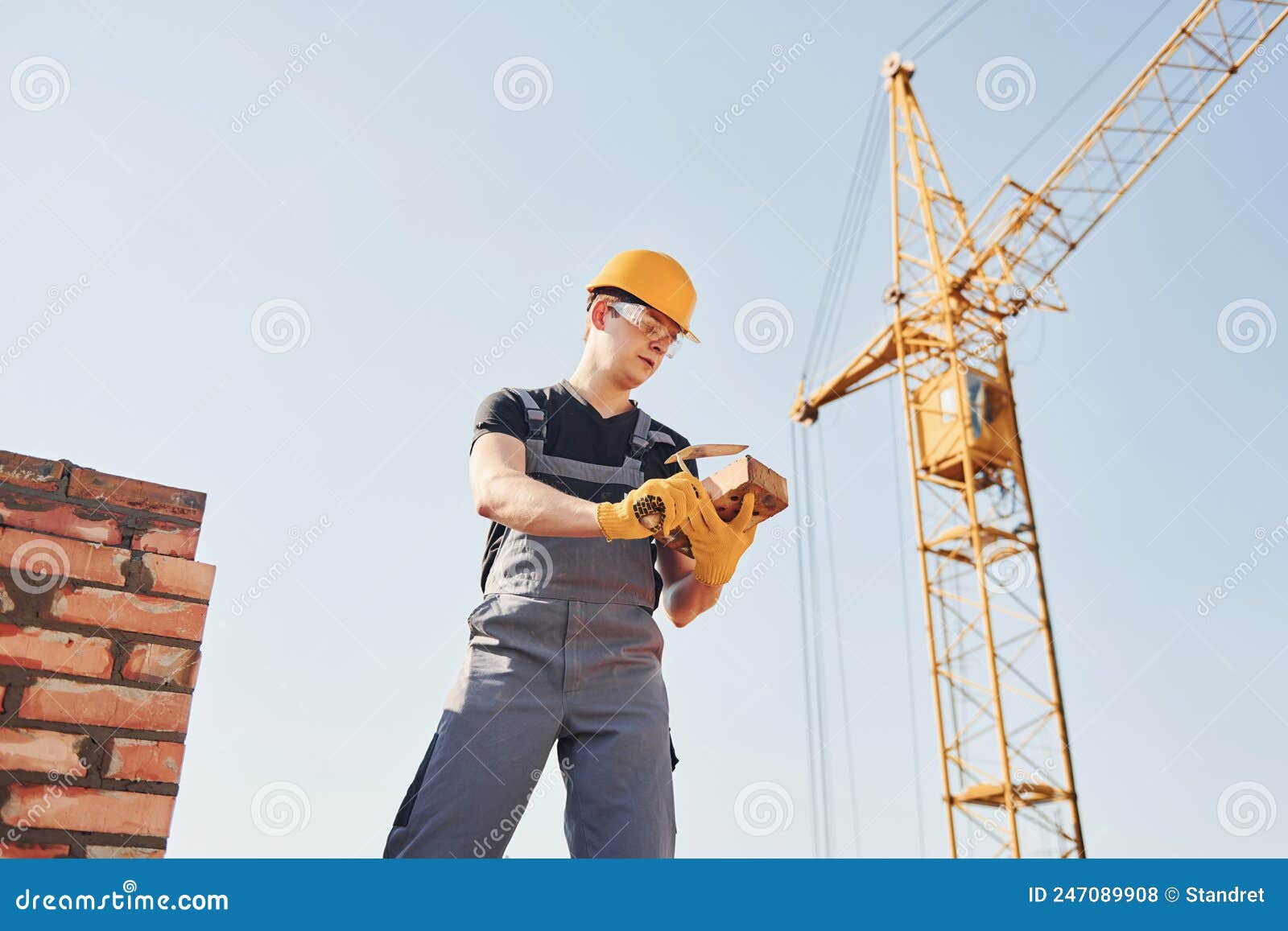 Construction Worker in Uniform and Safety Equipment Have Job on ...