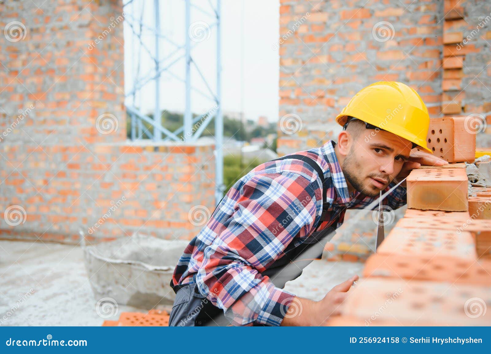 Construction Worker in Uniform and Safety Equipment Have Job on ...