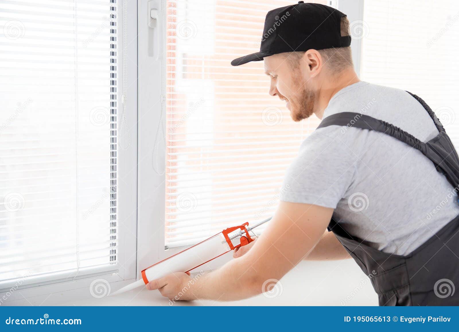 Construction Worker Use Gun Silicone Tube for Repairing and Installing ...