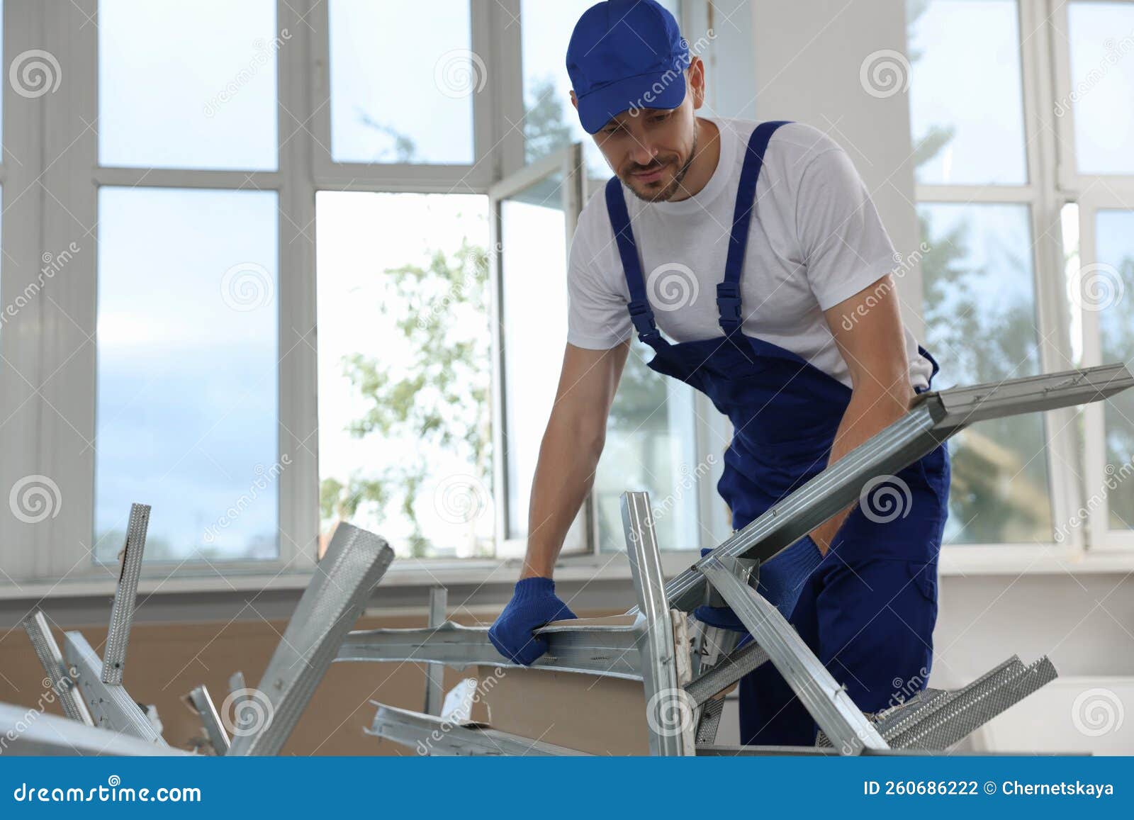 Construction Worker with Used Building Materials in Room Prepared for ...