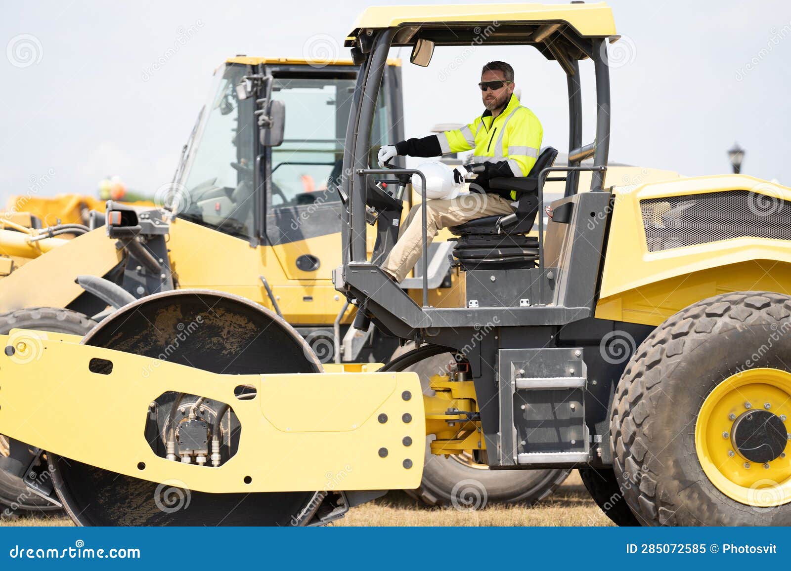 Construction Worker Used Heavy Machinery. Construction Industry with ...