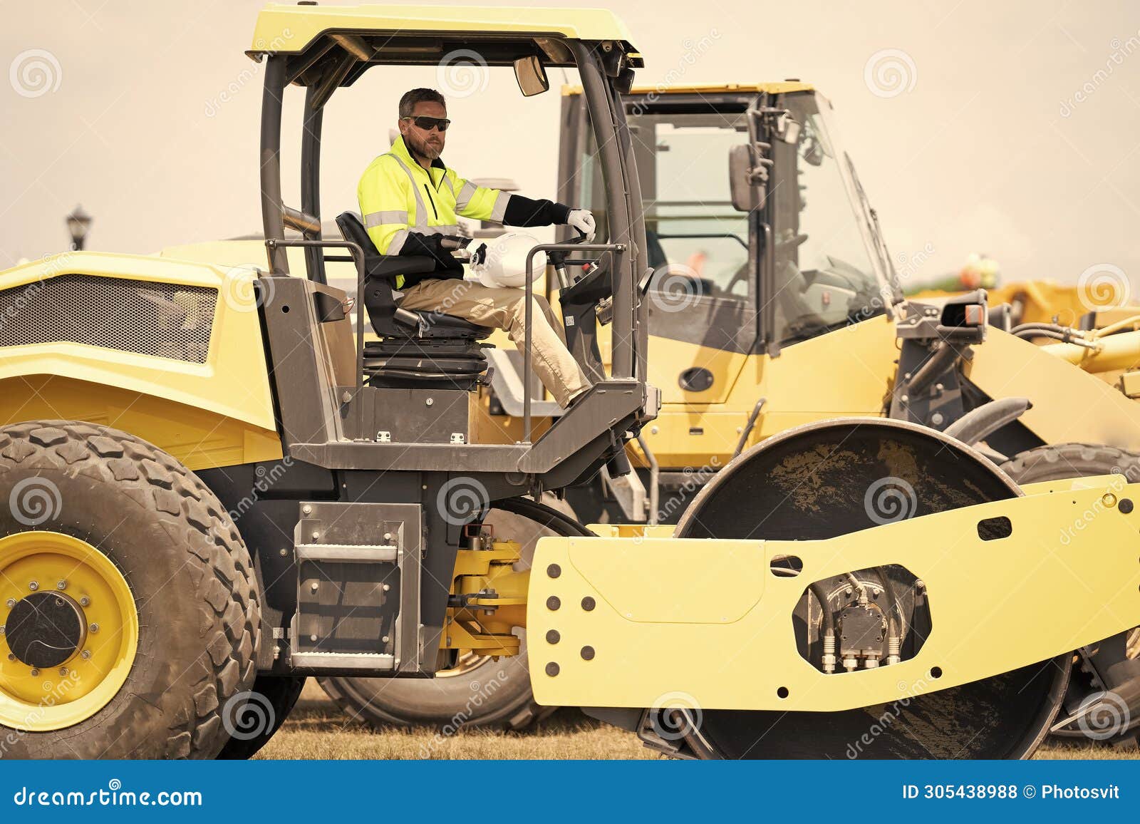 Construction Worker Used Heavy Machinery. Construction Industry with ...
