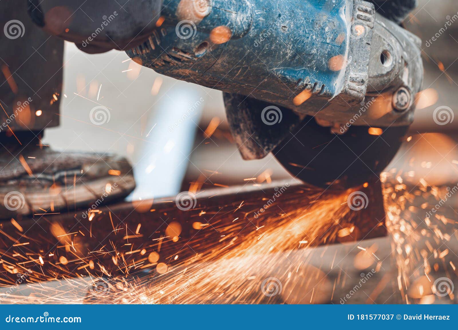 Construction Worker Using Angle Grinder Cutting Metal at Construction ...