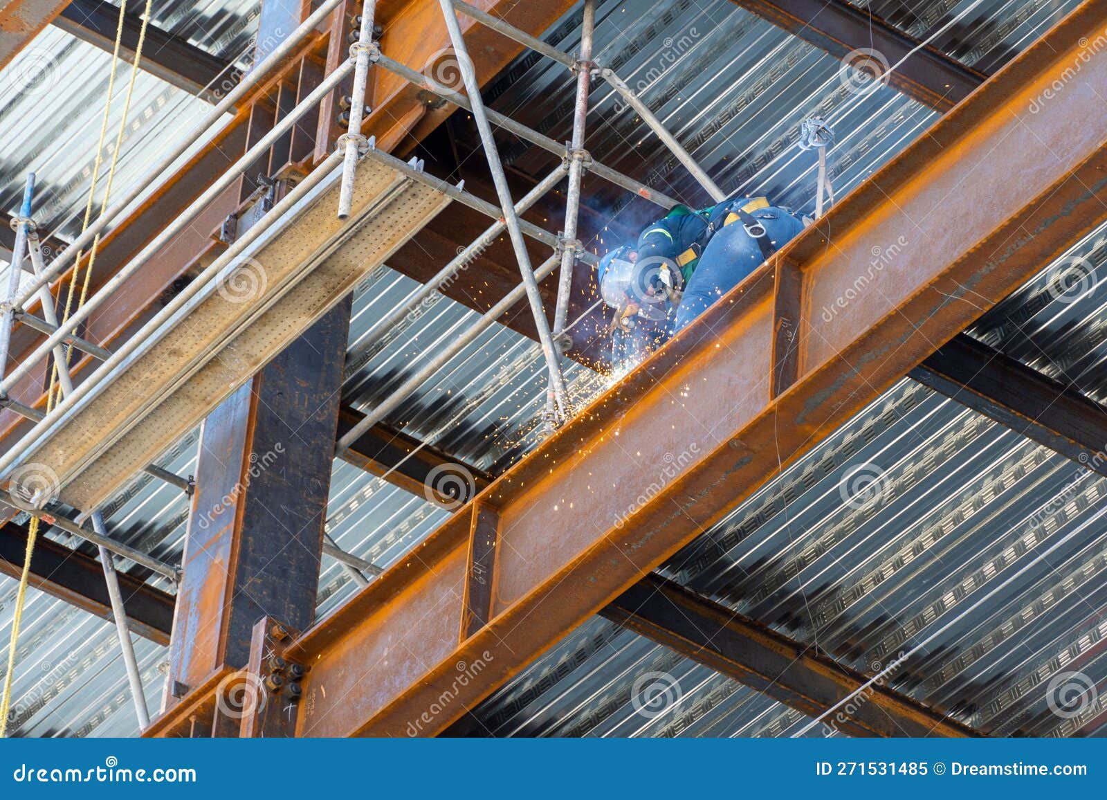 Construction Worker Using an Angle Grinder on a Scaffold Stock Image ...