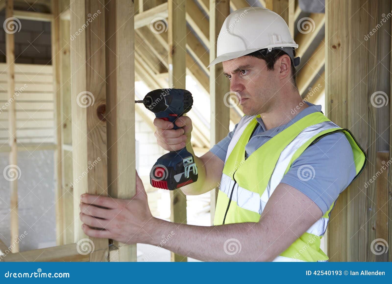 Construction Worker Using Cordless Drill On House Build Stock Image ...