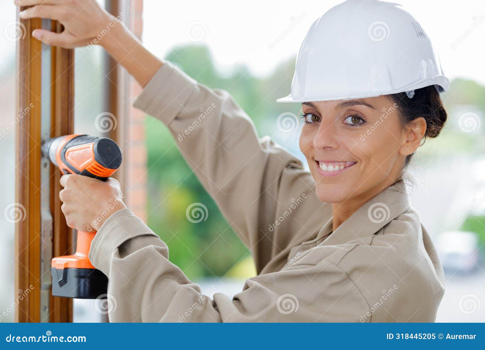 Construction Worker Using Cordless Screwdriver on Window Stock Image ...