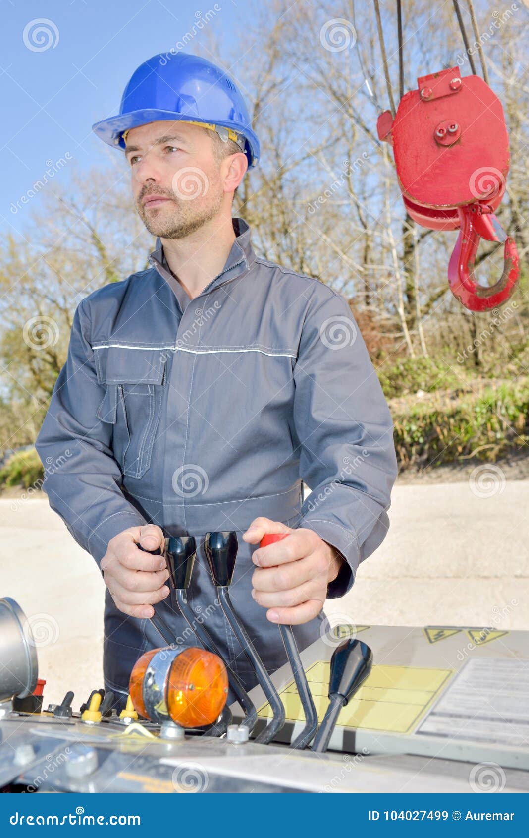 Construction Worker Using Crane at Building Site Stock Image - Image of ...
