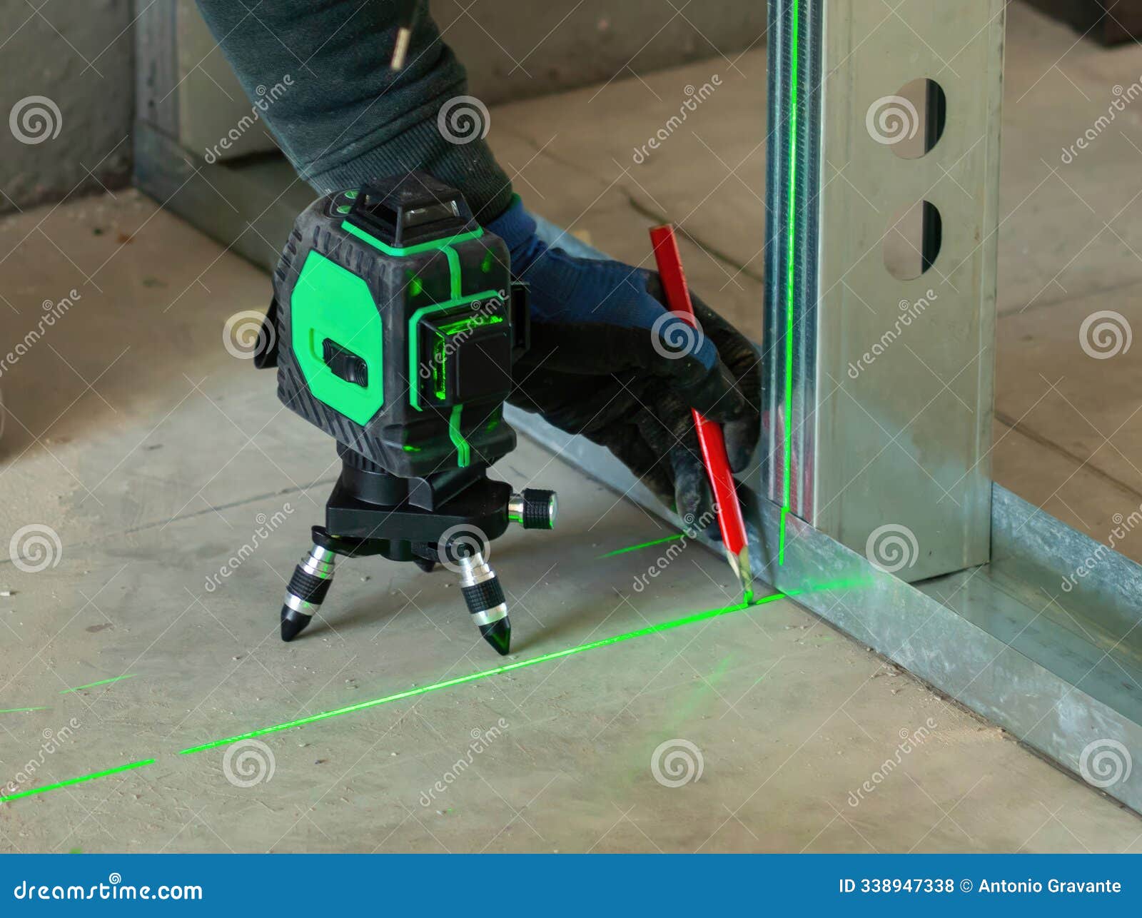 Construction Worker Using a Cross Line Laser Level during Finishing ...