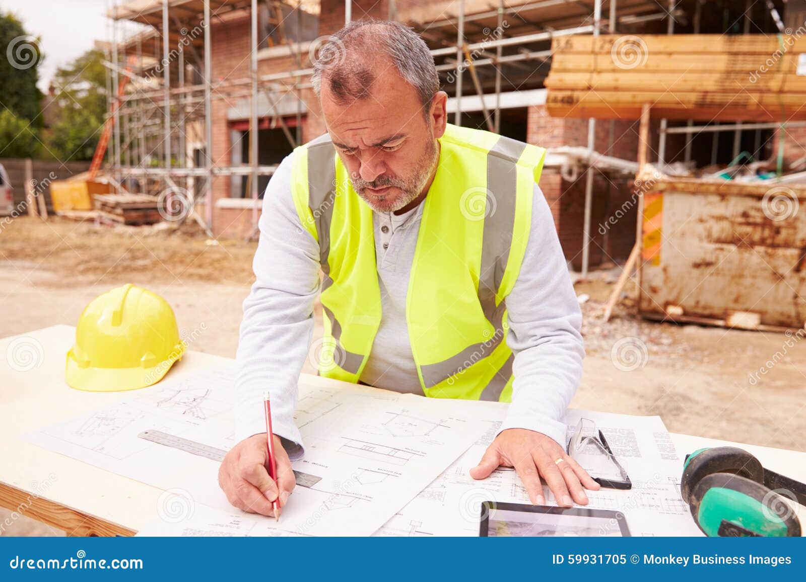 Construction Worker Using Digital Tablet on Building Site Stock Image ...