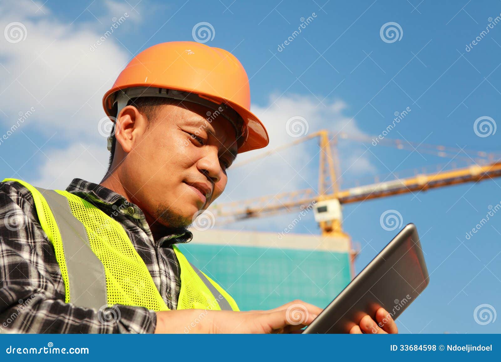 Construction Worker Using Digital Tablet Stock Photo - Image of holding ...